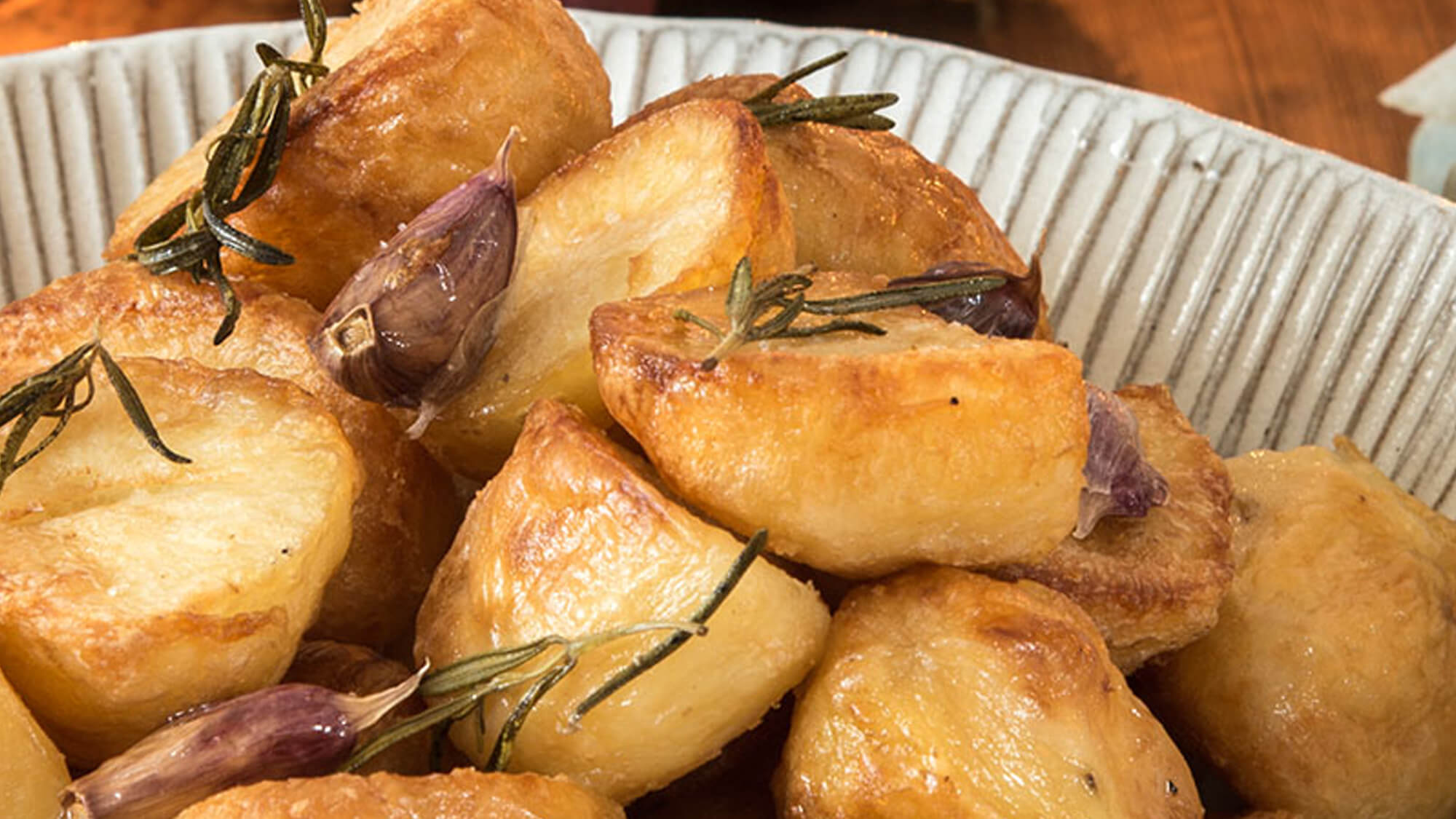 Garlic and Rosemary Roast Potatoes Recipe | Christmas | ao.com